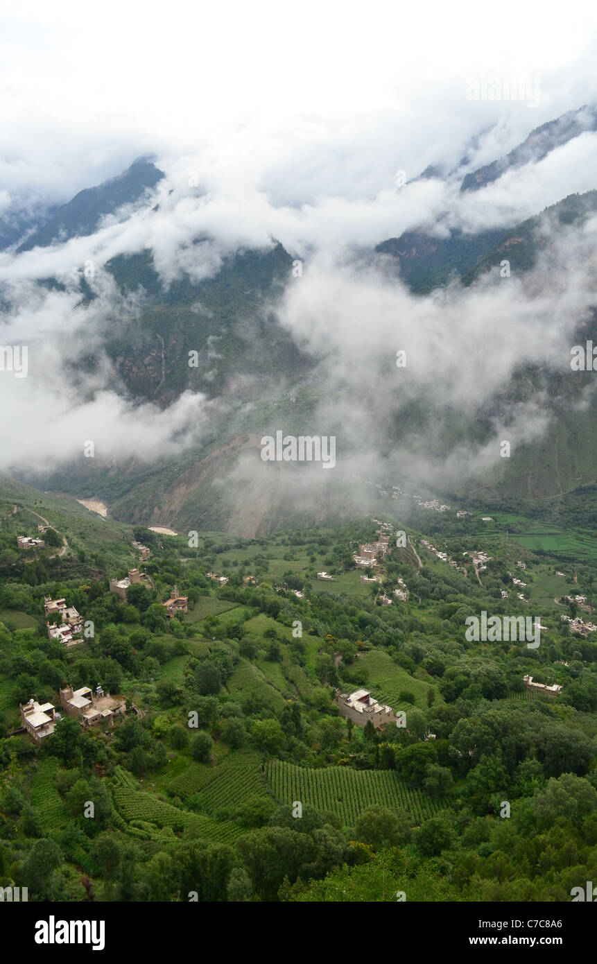 Cloud swirls around mountains across the valley from the lovely Tibetan ...