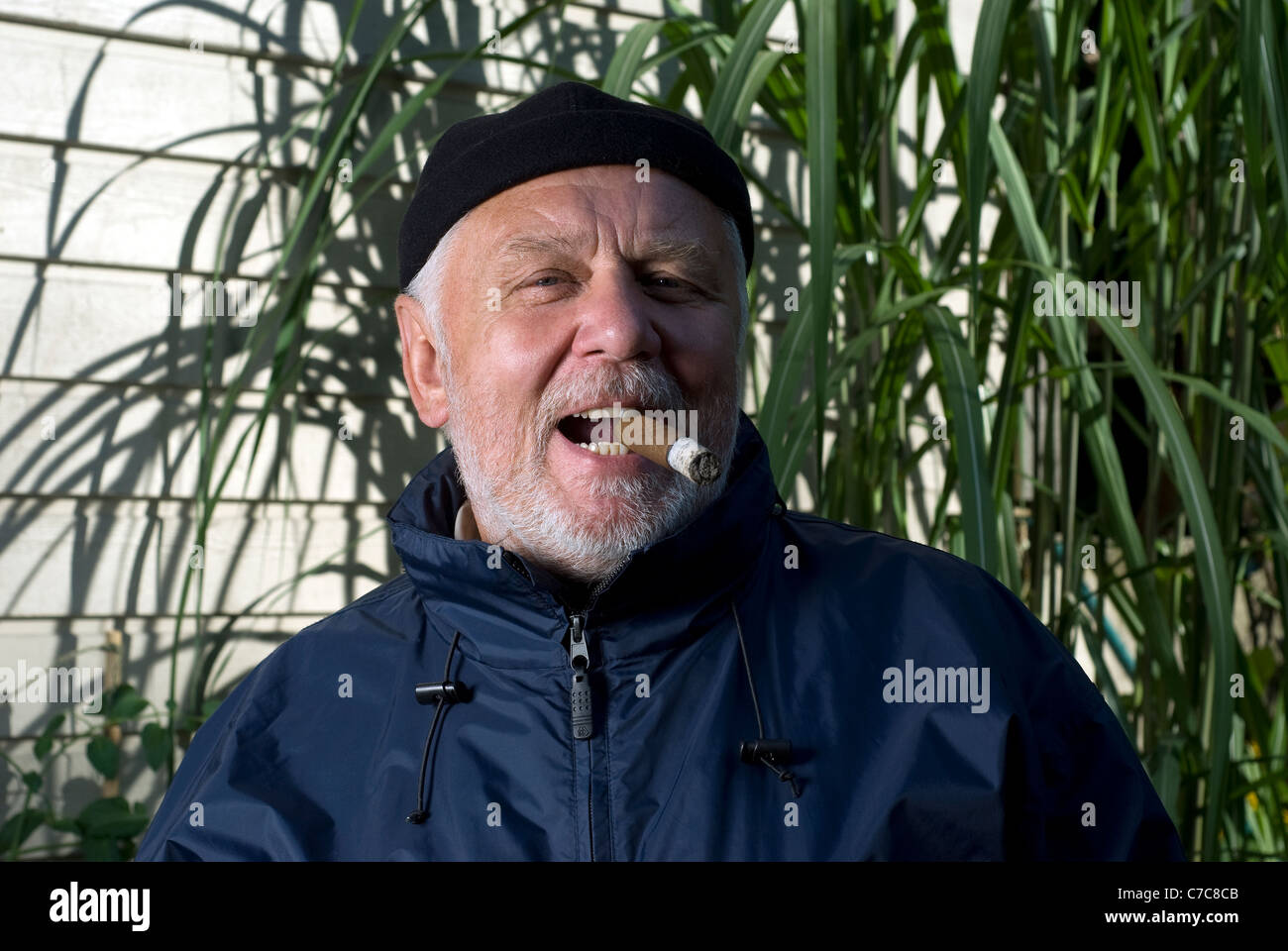 Cigar smoker in the garden Stock Photo - Alamy