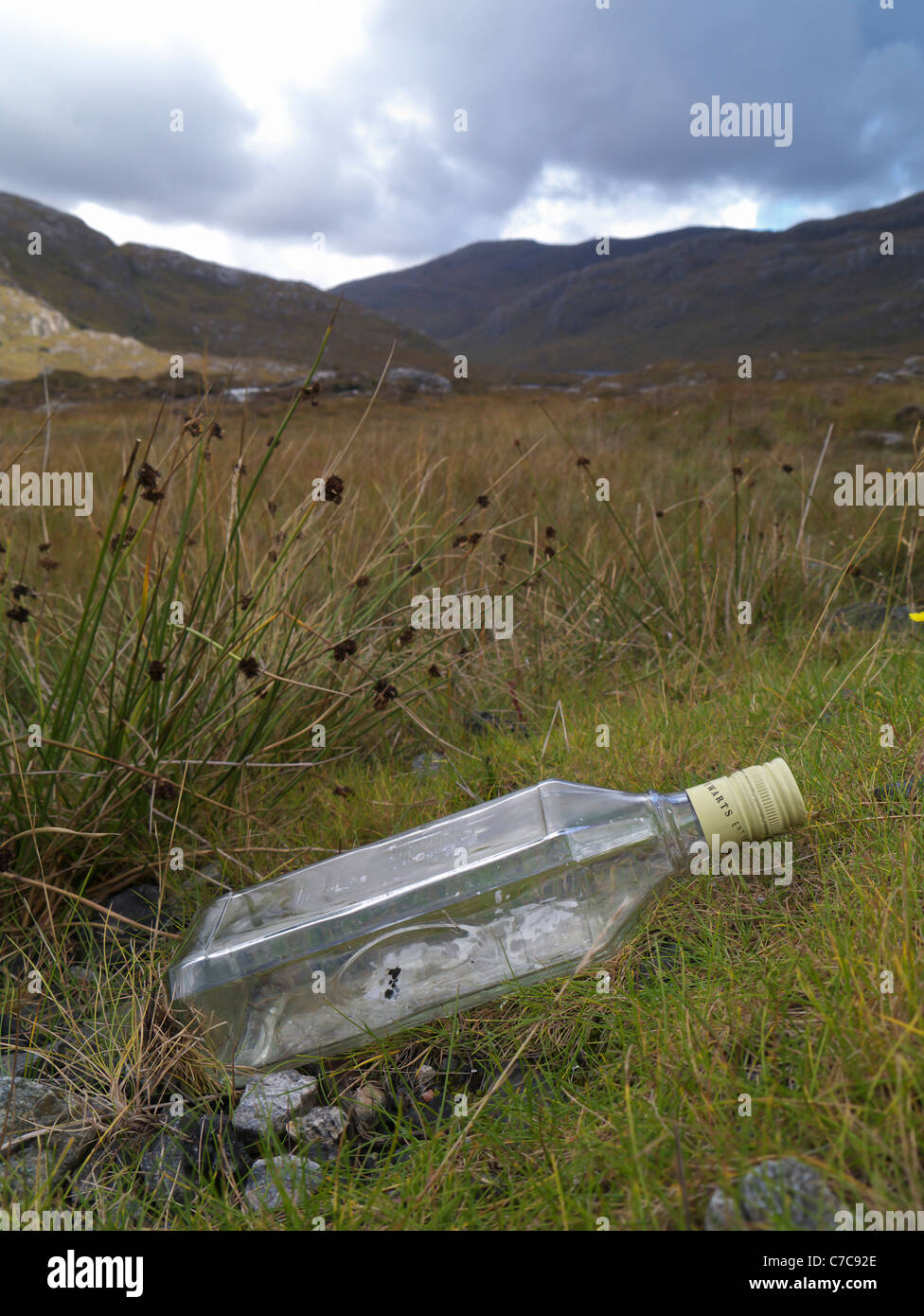 A bottle of alcoholic spirits litters the beautiful Scottish ...