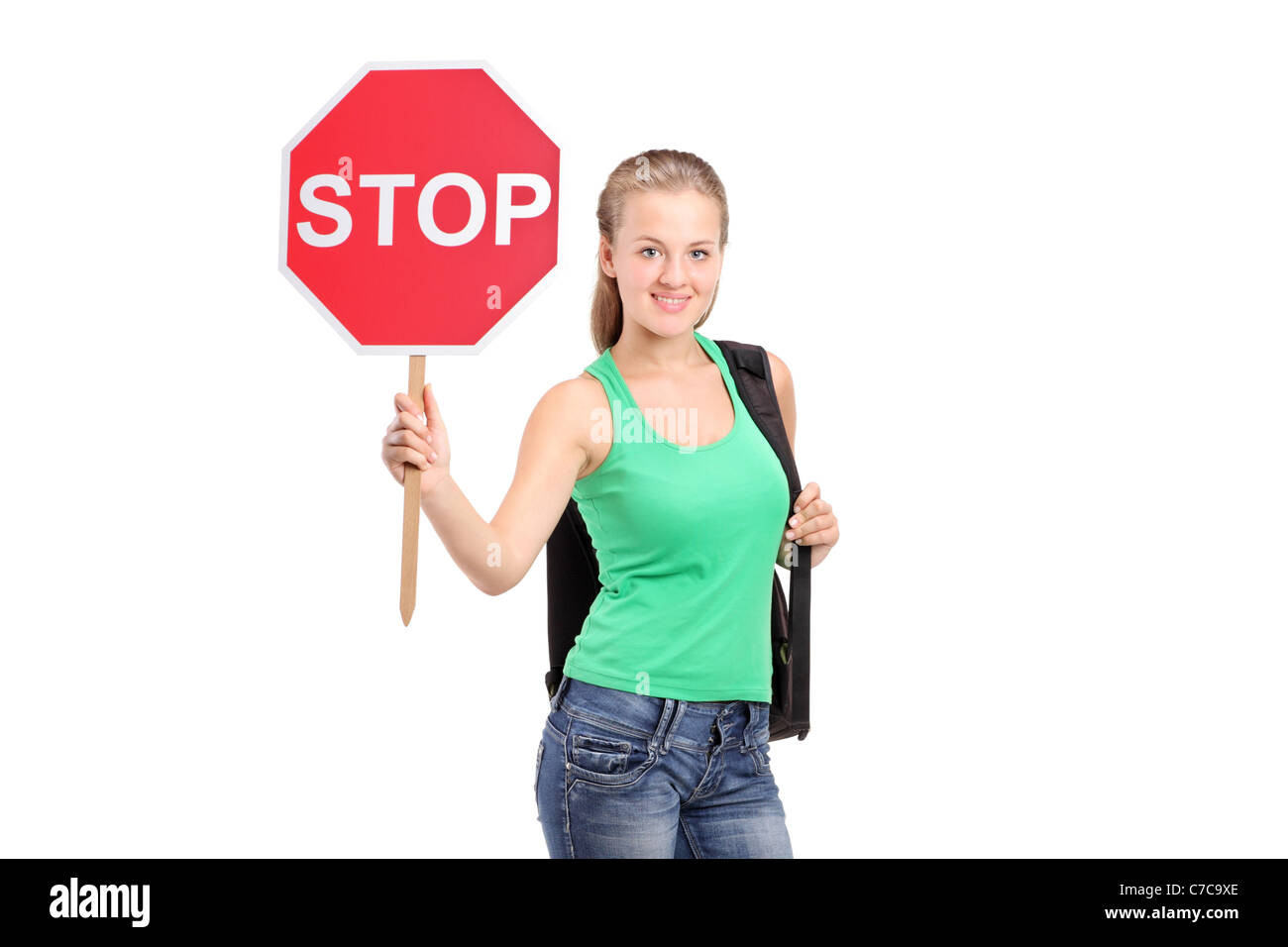 A young woman holding a traffic sign stop Stock Photo - Alamy