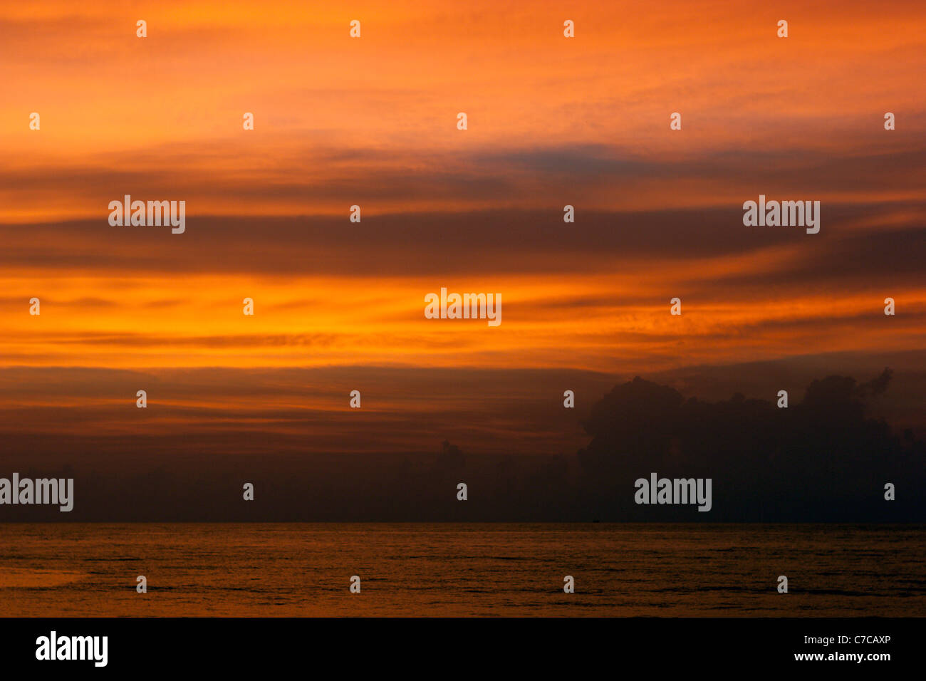 Gold sunset in southern Thailand at the sea with predominant yellow ...