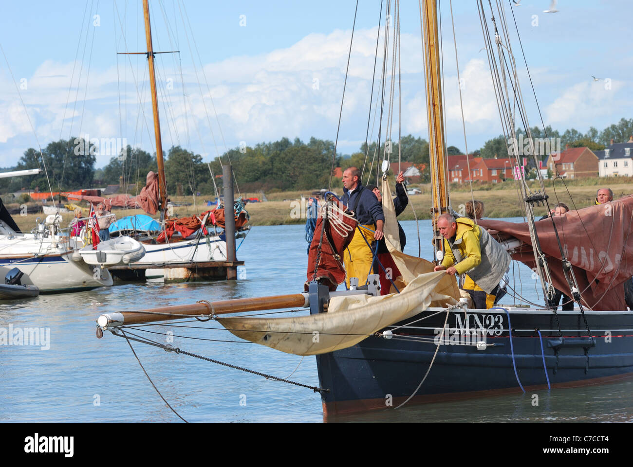 Boat coming into shore Stock Photo - Alamy