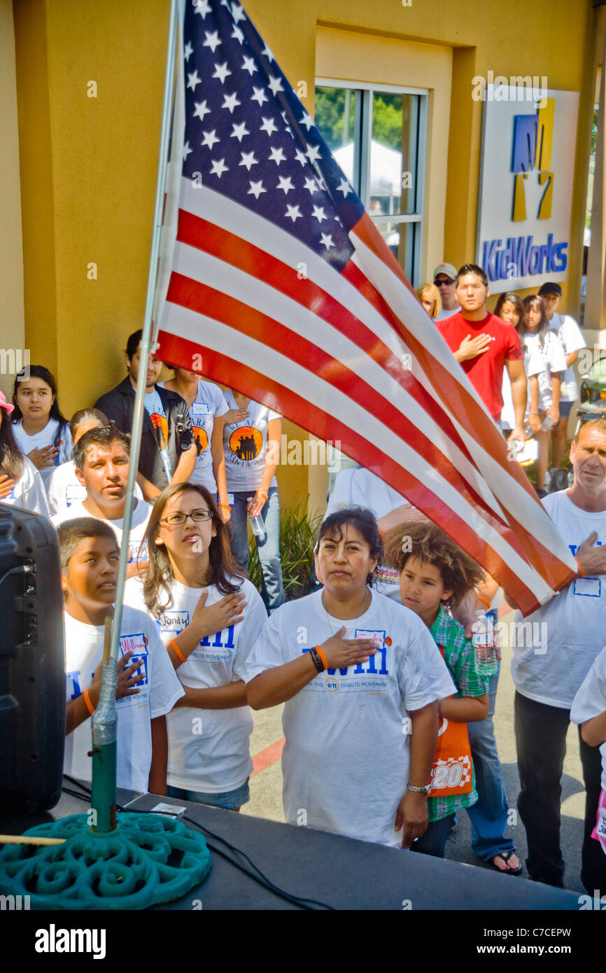 Volunteers at a community beautification event in Santa Ana, CA, recite ...