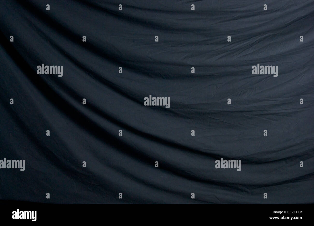 A simple draped black photographer's studio background cloth Stock ...