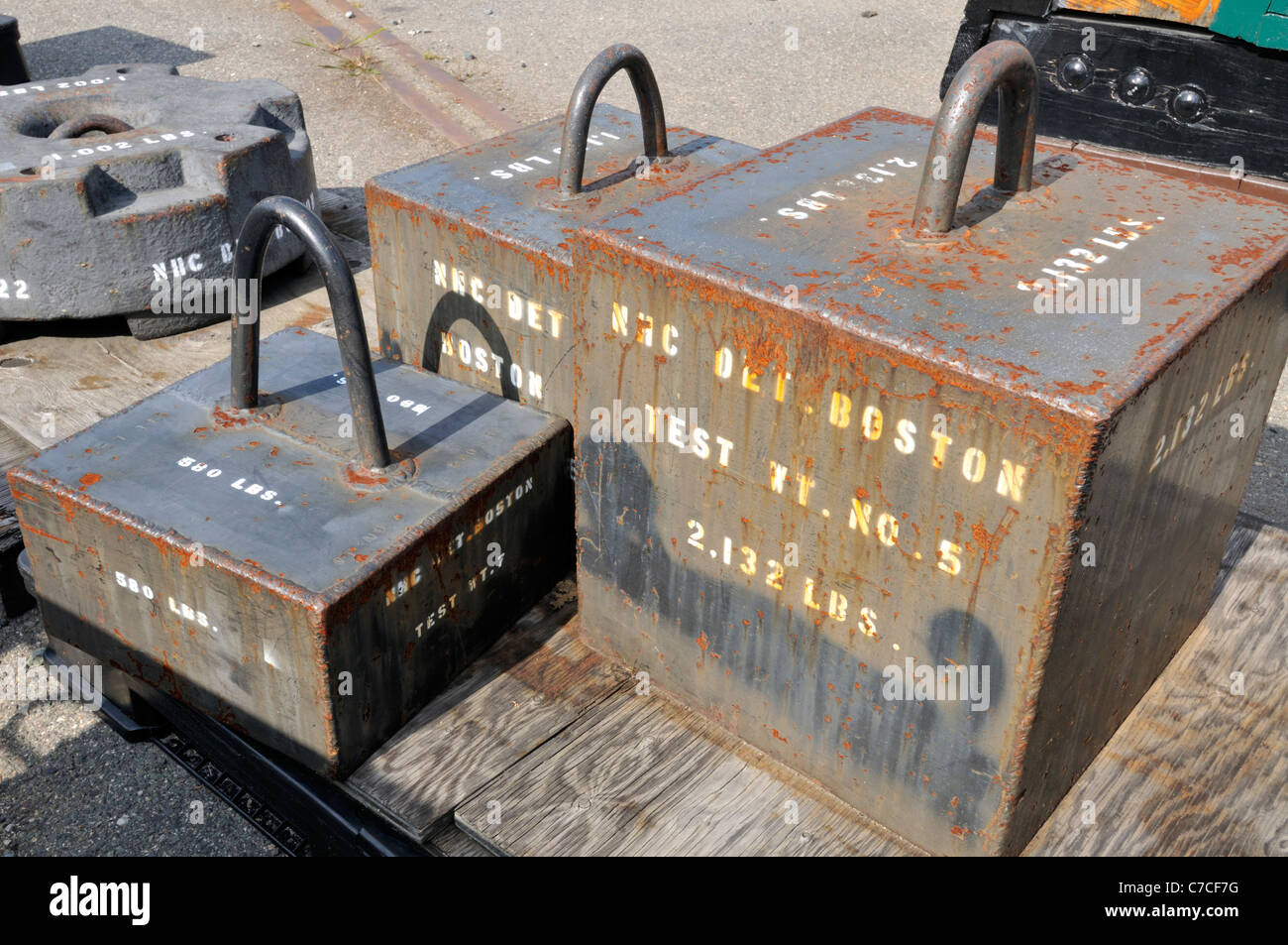 Heavy test weights on a wood pallet Stock Photo - Alamy