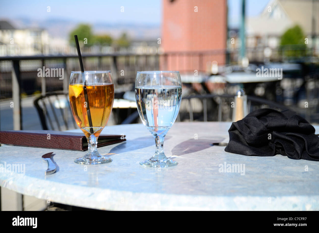 two full glasses on a restaurant table Stock Photo - Alamy