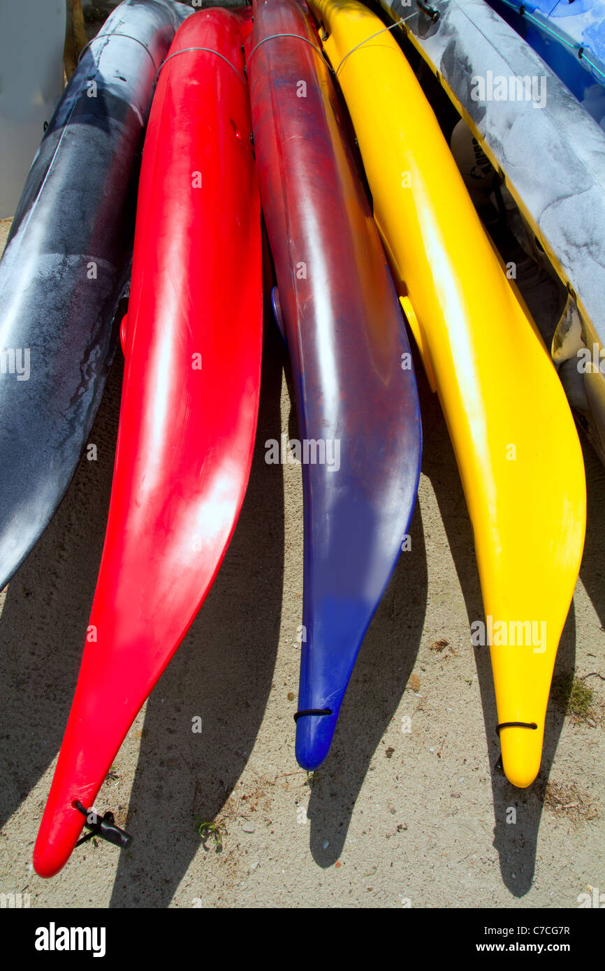 Beach colorful kayak rows lying on sand in sunny Mediterranean Island ...