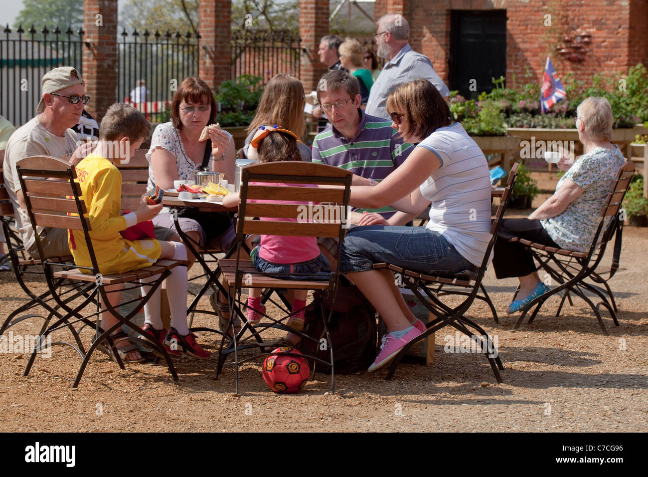 Family, friends lunch time picnic. Outdoors Visitor Centre. Summer ...