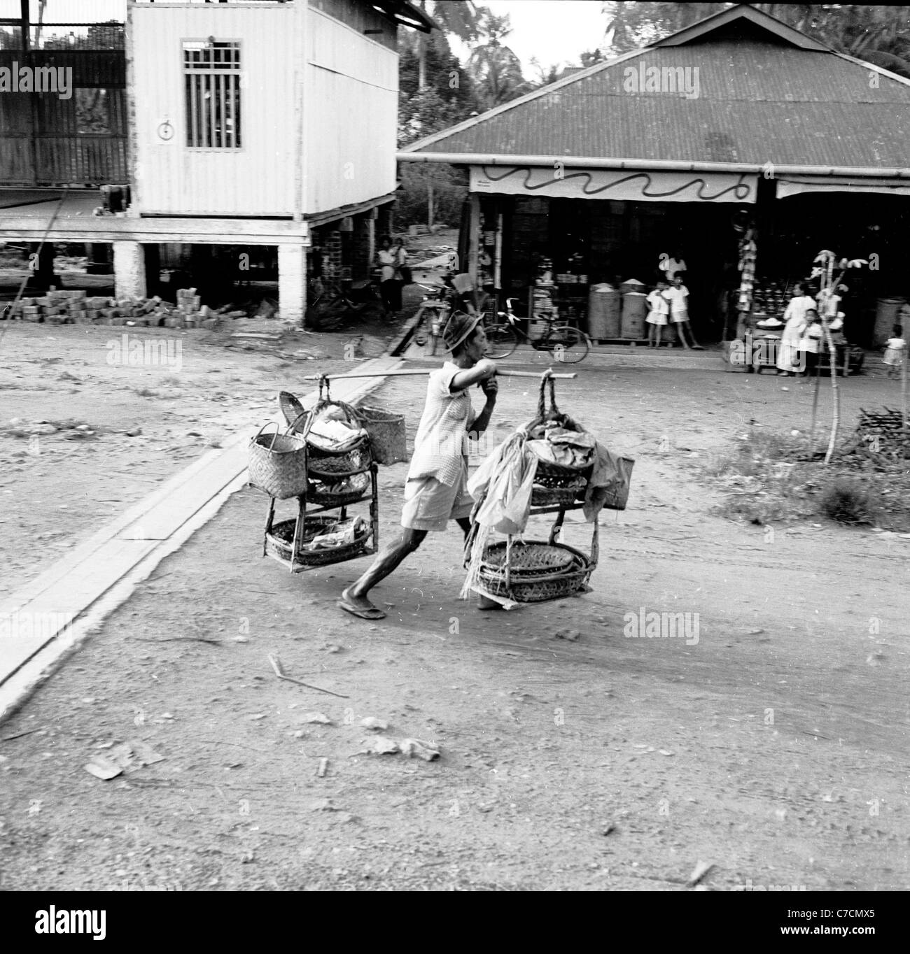Man carrying baskets on shoulder hi-res stock photography and images ...