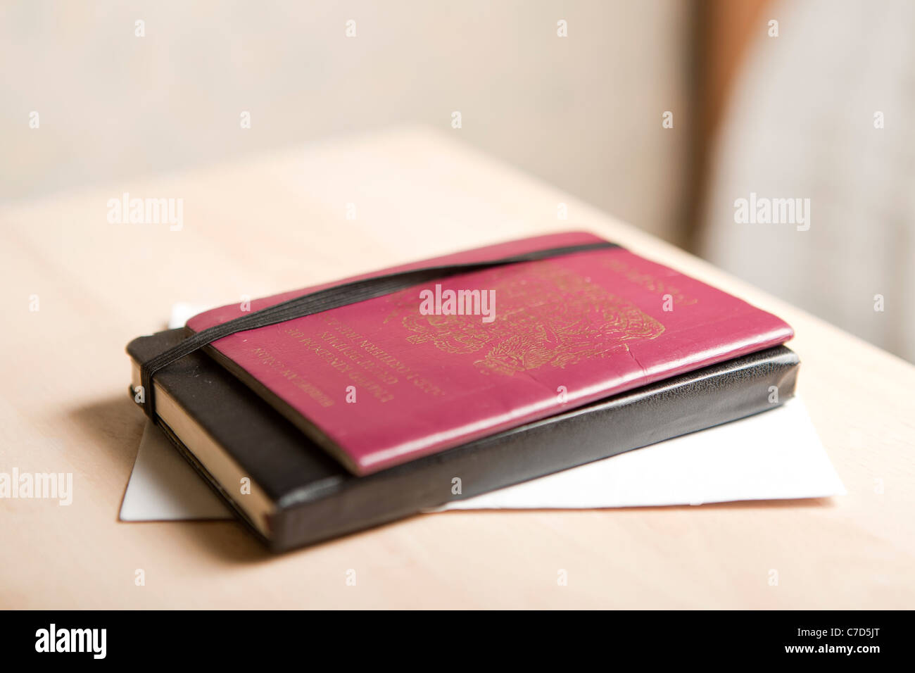 Notebook and passport Stock Photo - Alamy