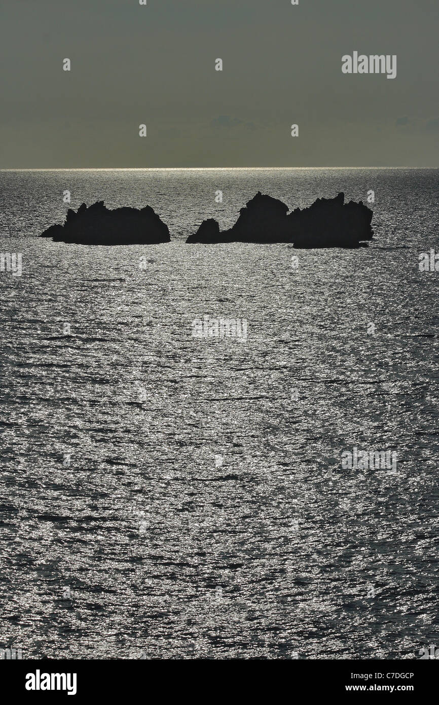 glittering sea surface with a rocks Stock Photo - Alamy