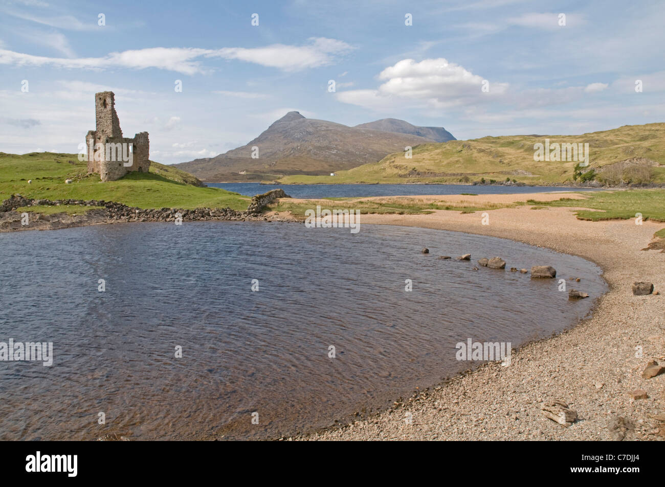 Ardvreck Castle on the shores of Loch Assynt, Scotland, with the peaks ...