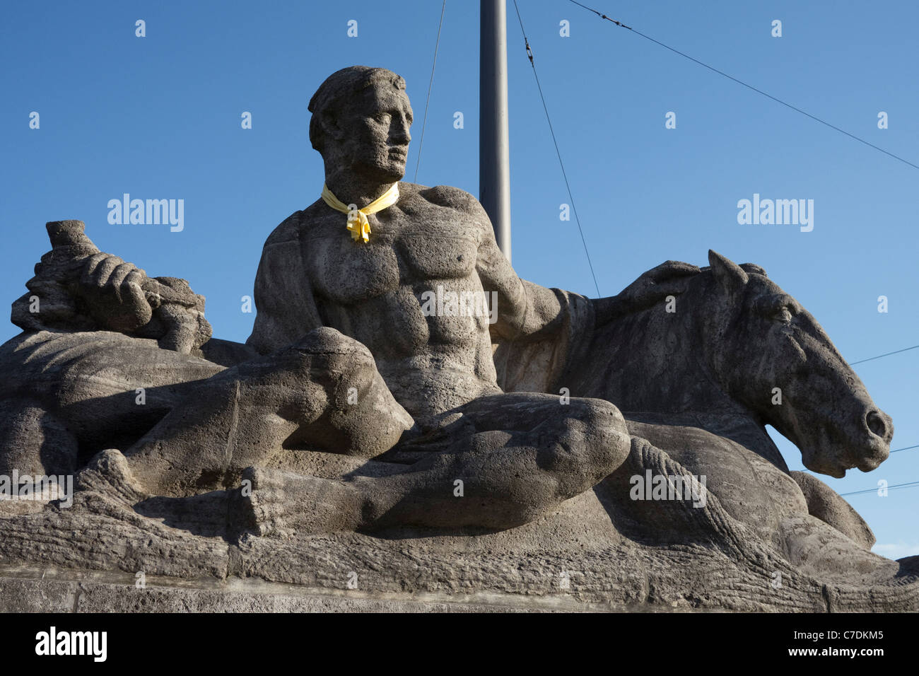 Rider statue with yellow scarf tied to neck Stock Photo - Alamy