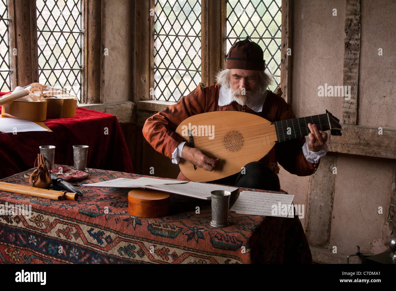 Public demonstration and historical re-enactment of a musician playing ...