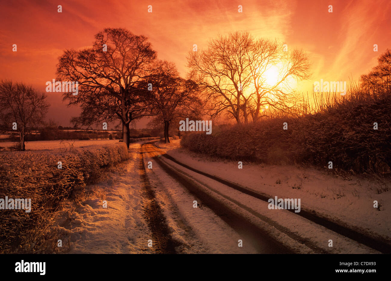 deep winter snow on country road at sunset near Huttons Ambo Yorkshire ...