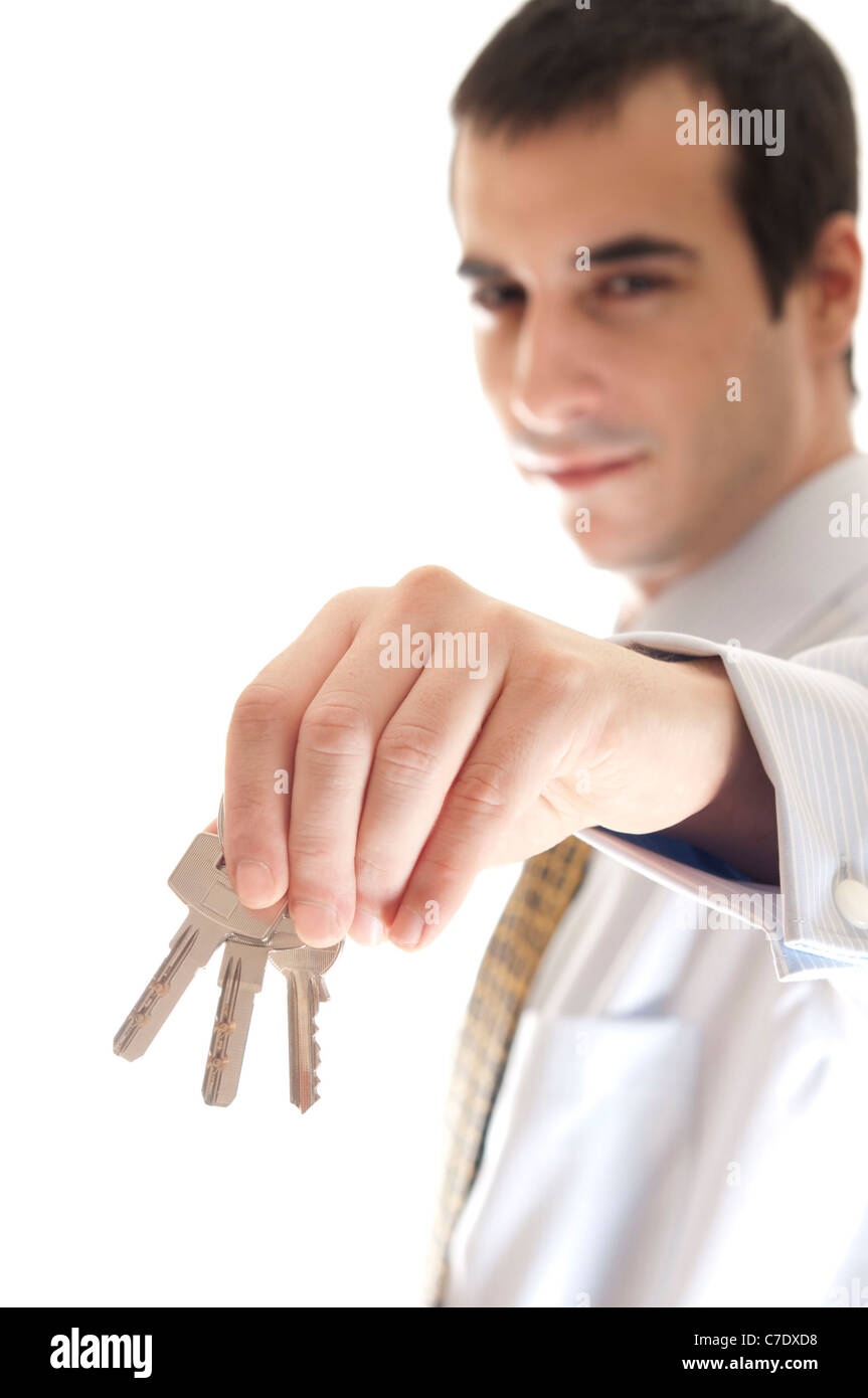Isolated business man with key in hand Stock Photo - Alamy