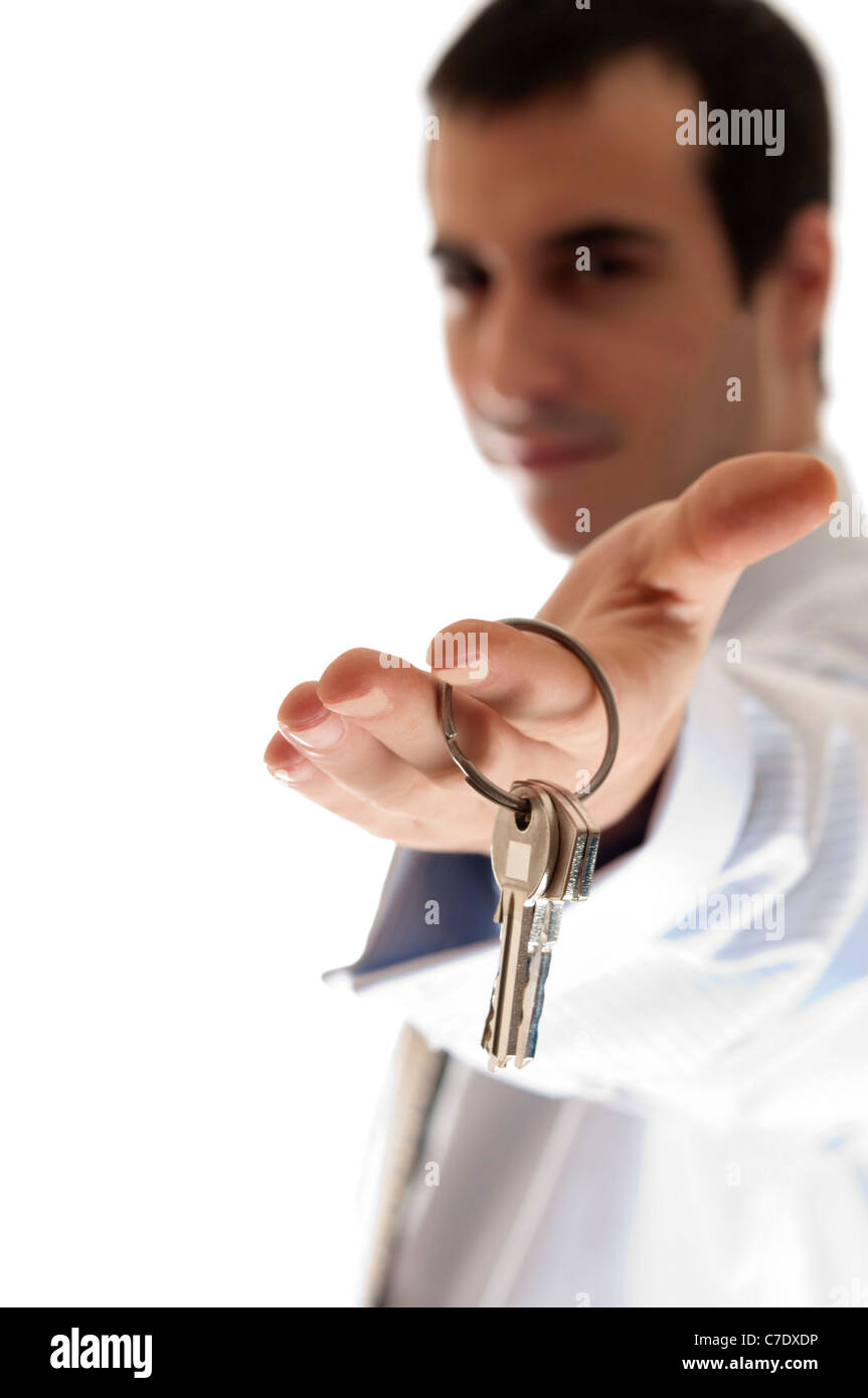 Isolated business man with key in hand Stock Photo - Alamy