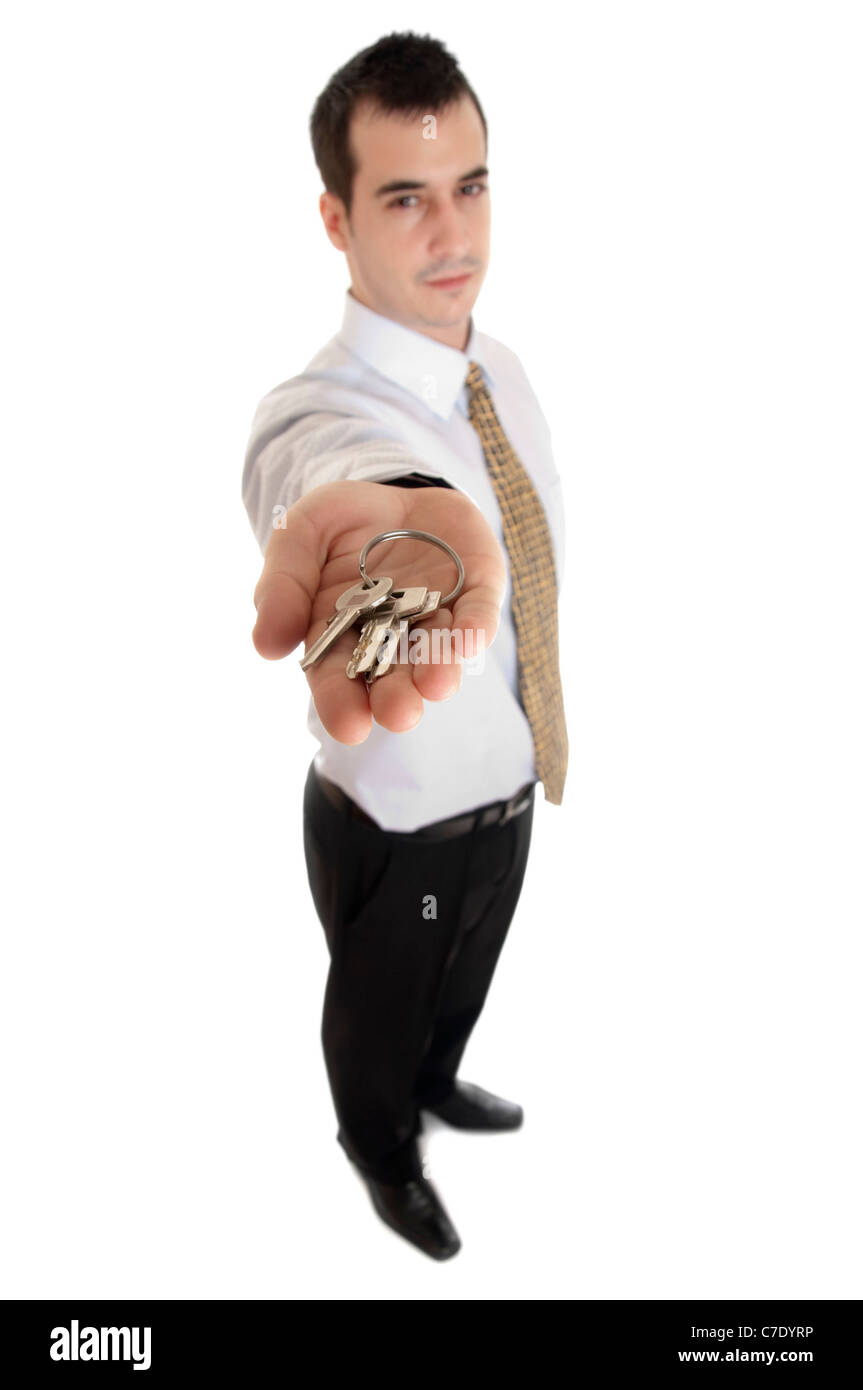 Isolated business man with key in hand Stock Photo - Alamy