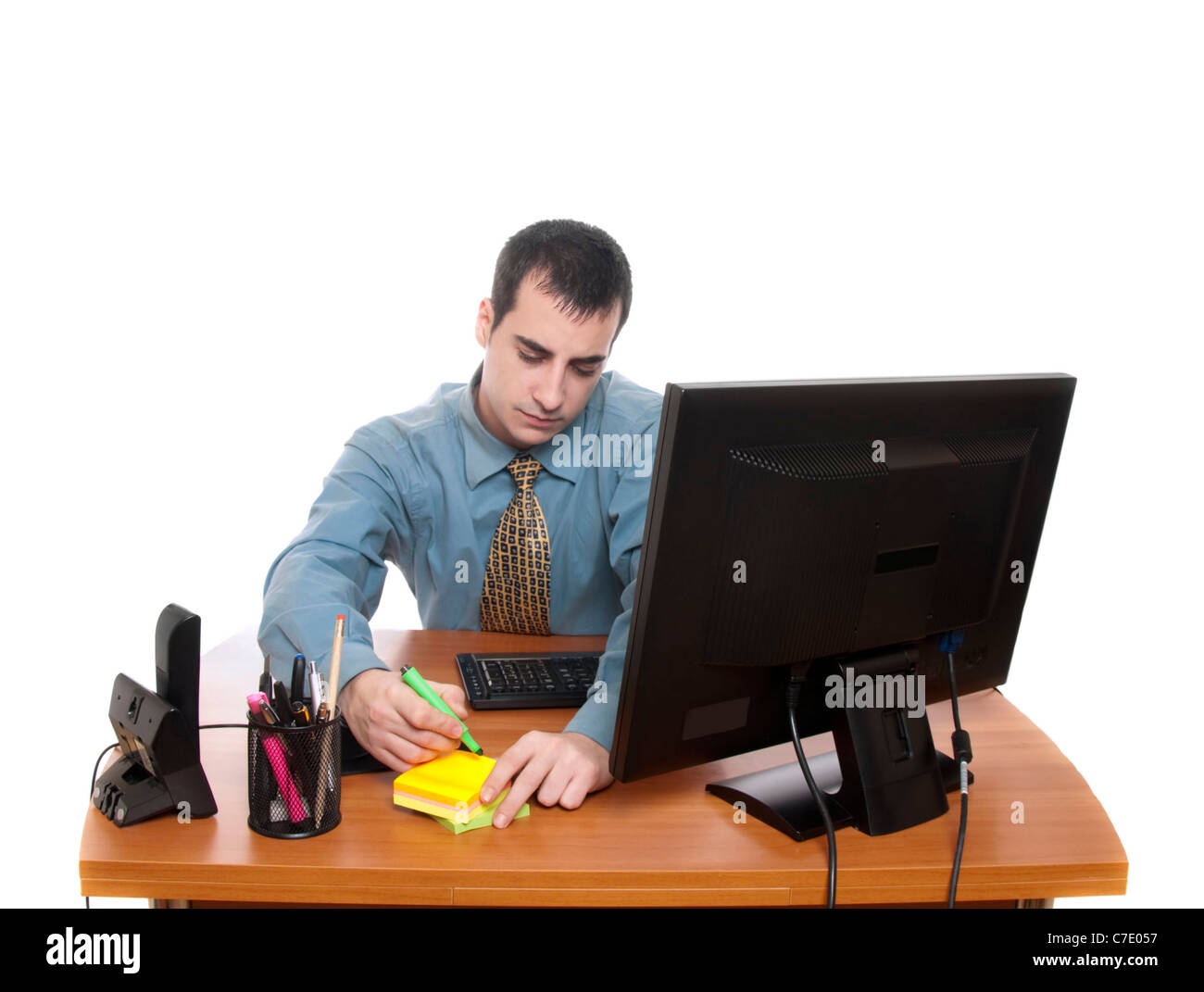 Isolated worker at office desk on white background Stock Photo - Alamy