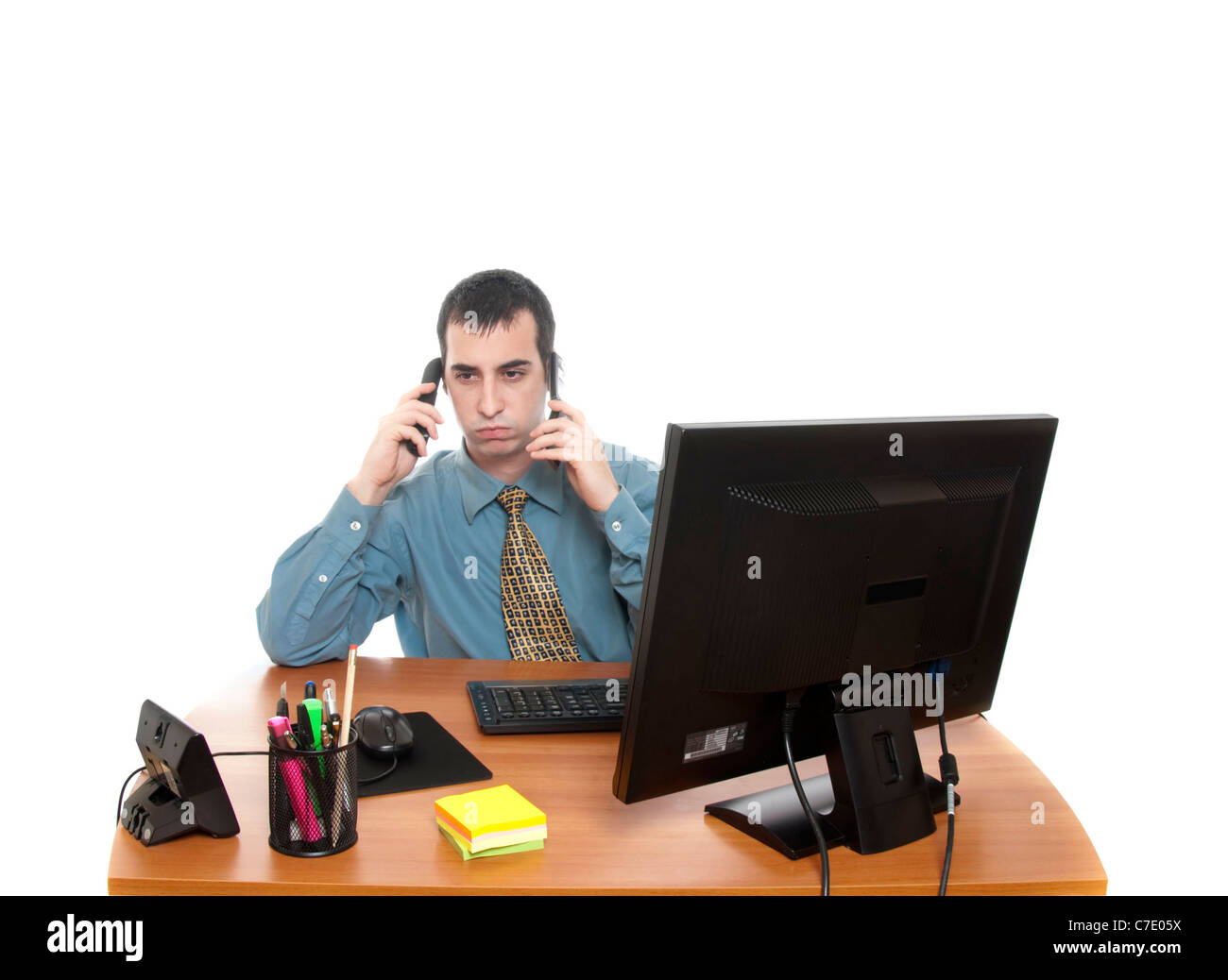 Isolated worker at office desk on white background Stock Photo - Alamy