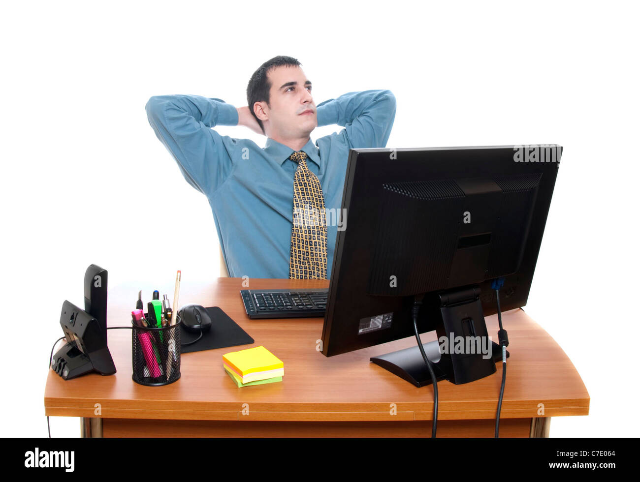 Isolated worker at office desk on white background Stock Photo - Alamy