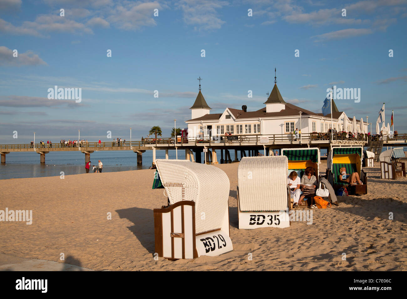 Beach chairs " Strandkorb " and the Seebruecke or Pier at the baltic ...