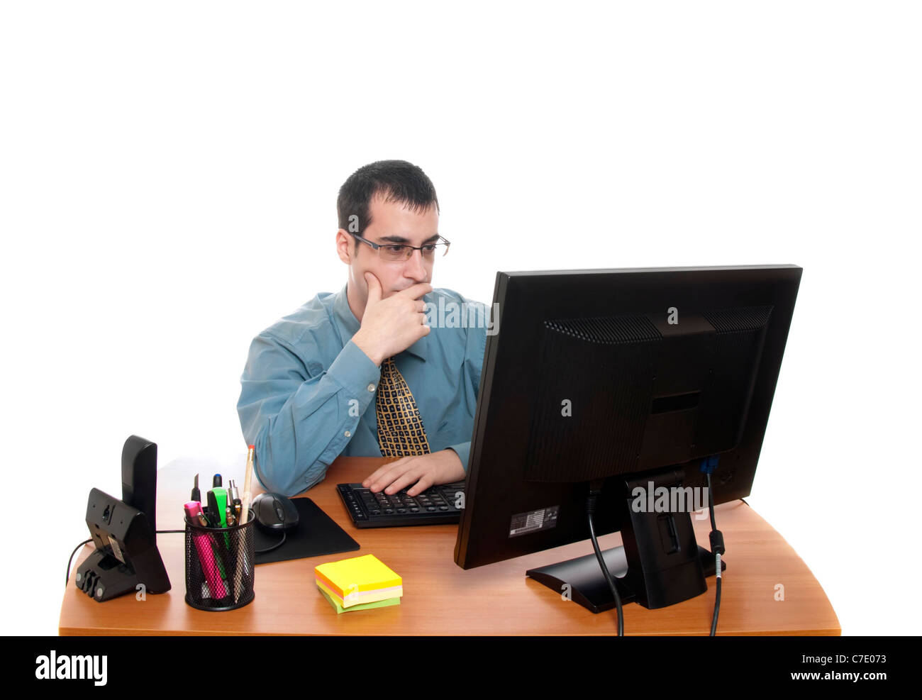 Isolated worker at office desk on white background Stock Photo - Alamy