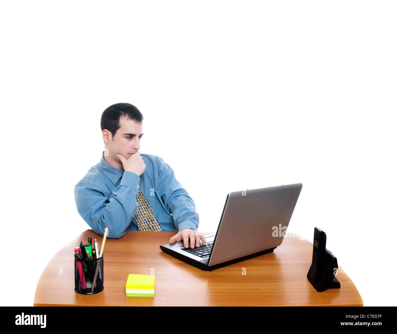 Isolated worker at office desk on white background Stock Photo - Alamy