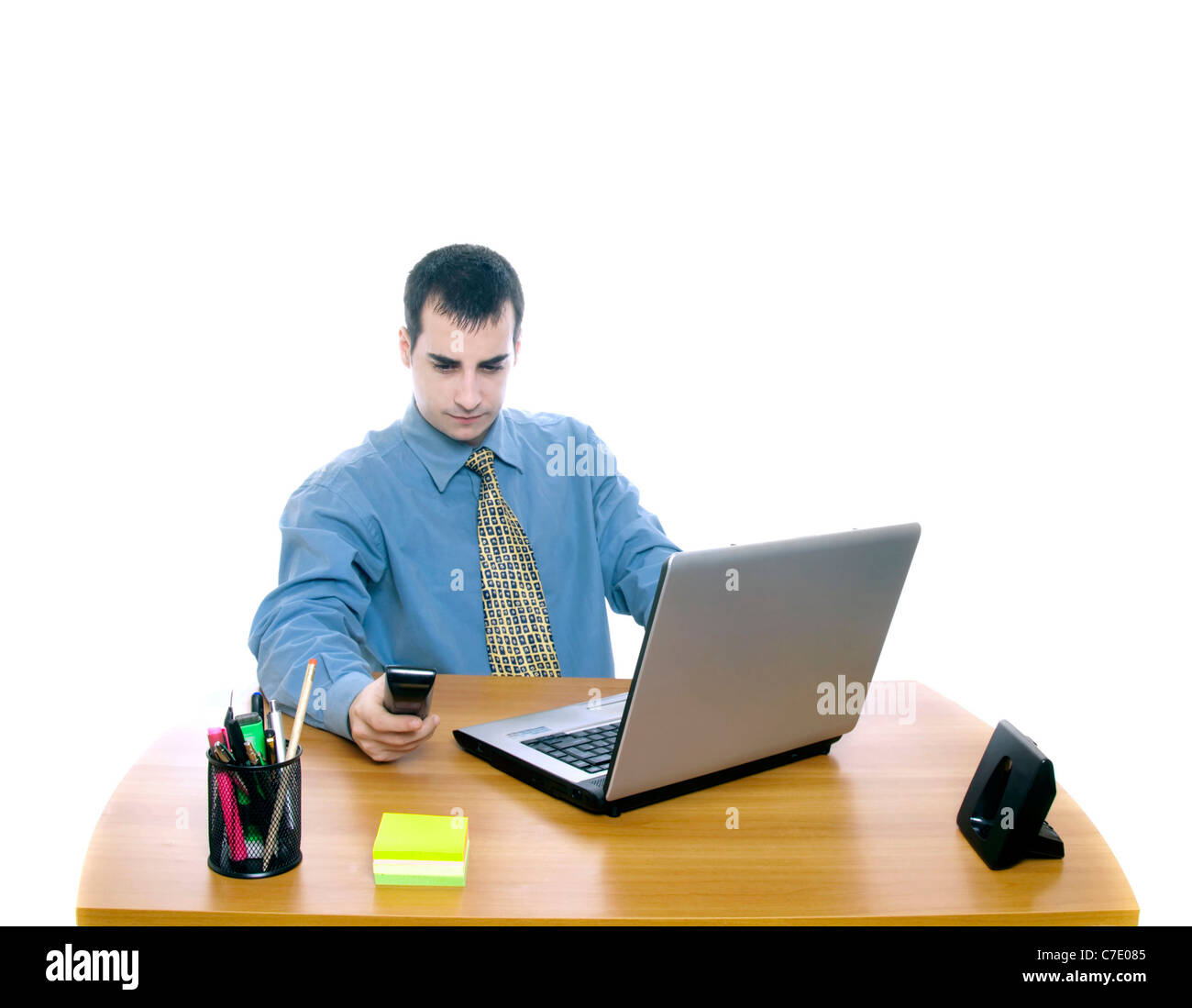 Isolated worker at office desk on white background Stock Photo - Alamy