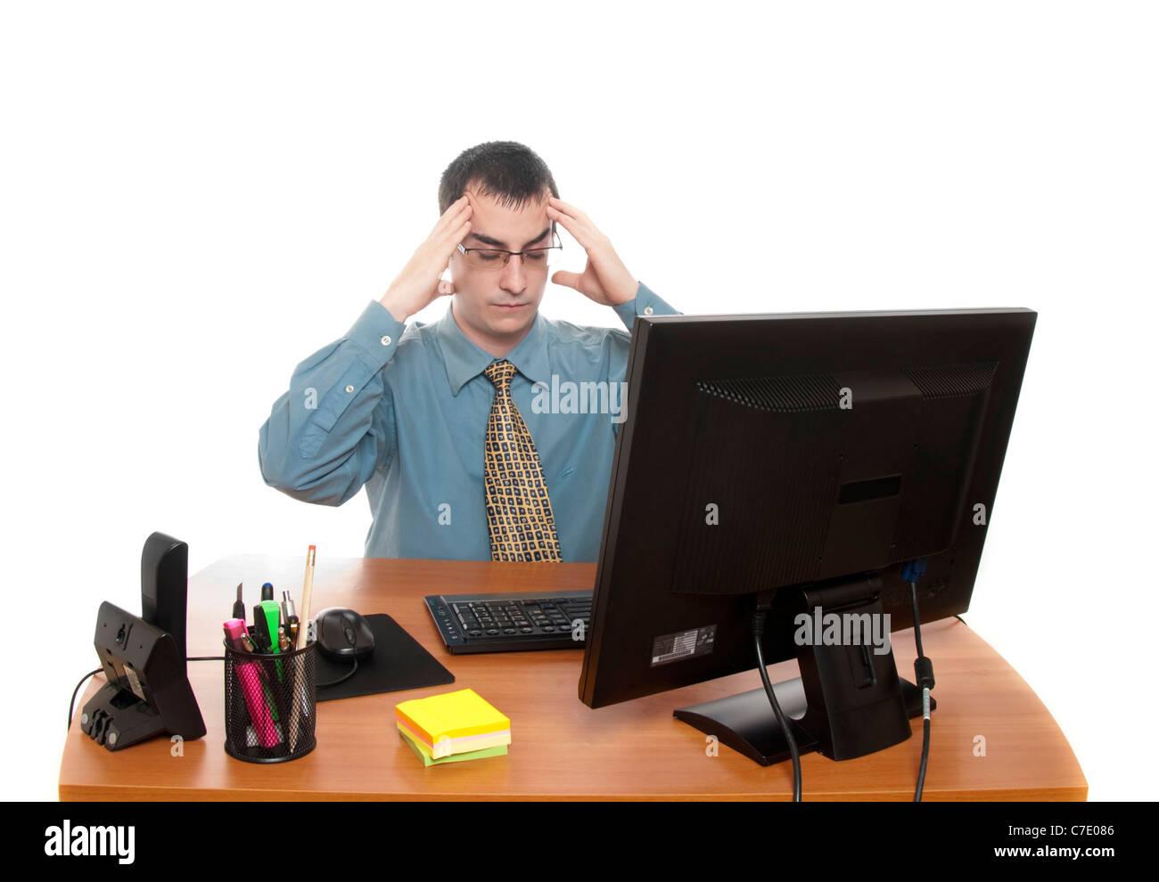 Isolated worker at office desk on white background Stock Photo - Alamy