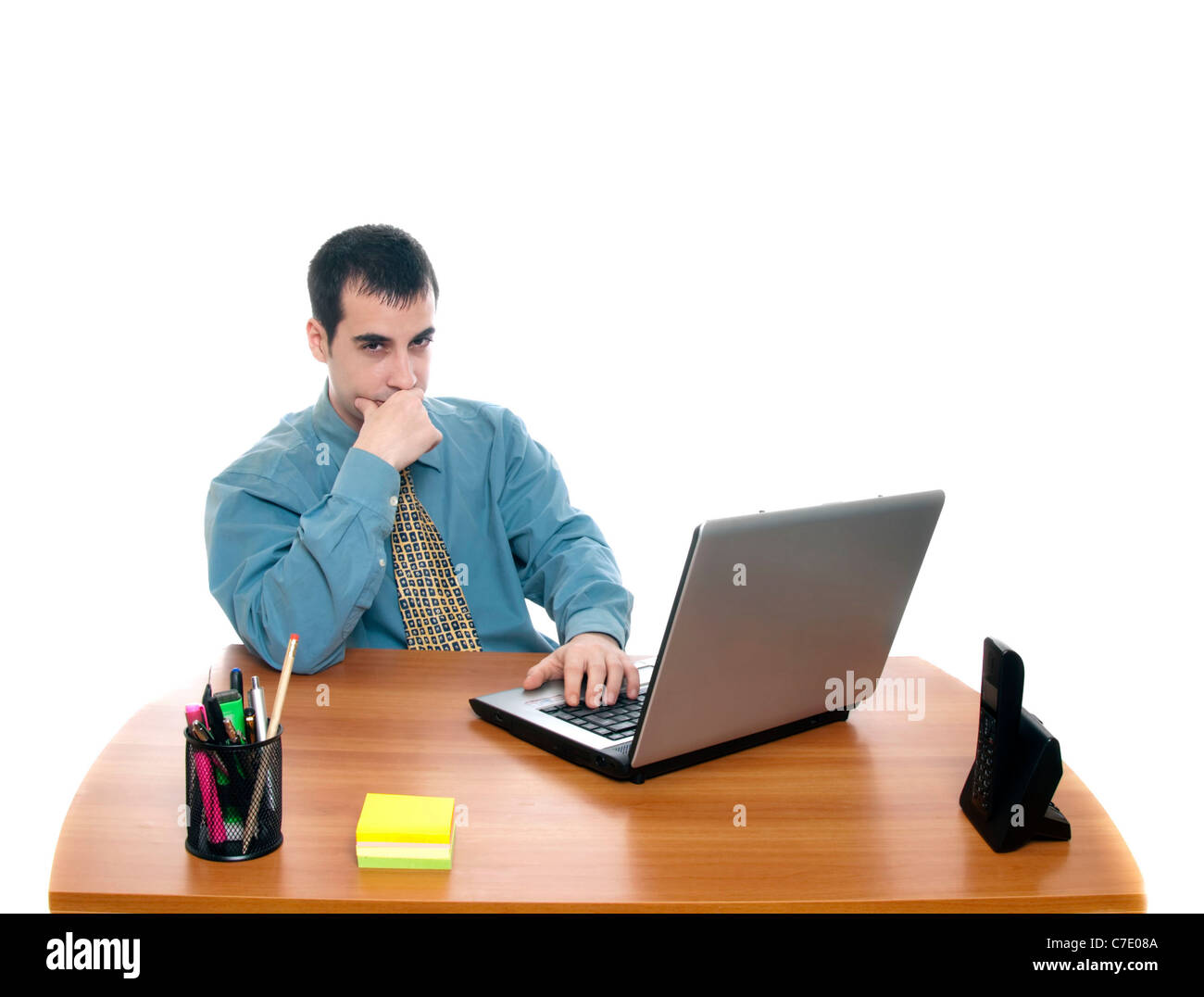 Isolated worker at office desk on white background Stock Photo - Alamy
