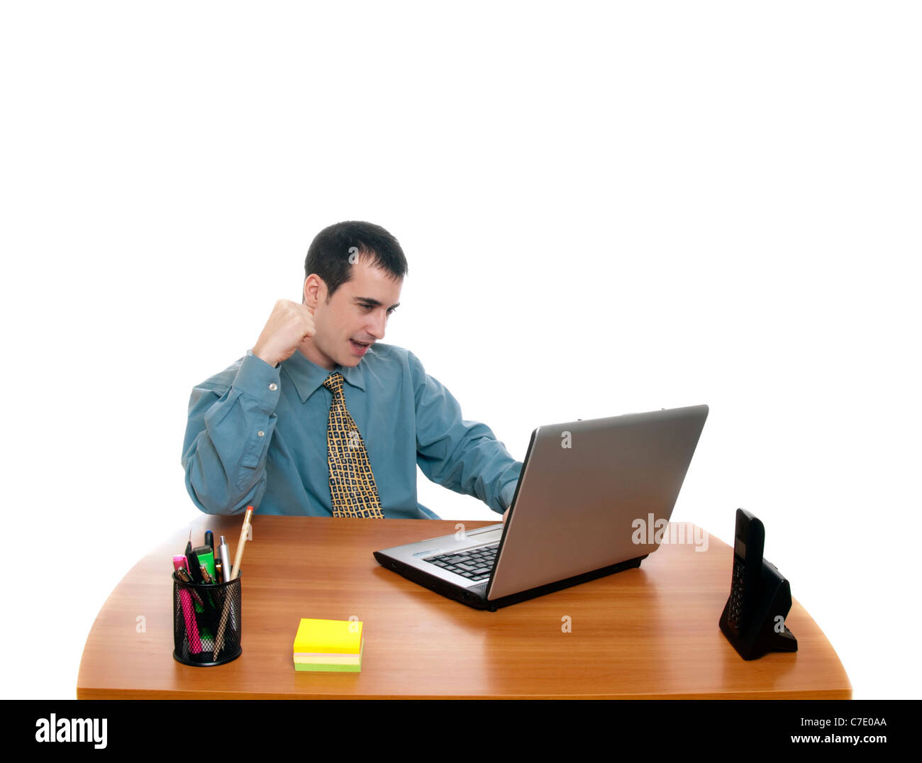 Isolated worker at office desk on white background Stock Photo - Alamy