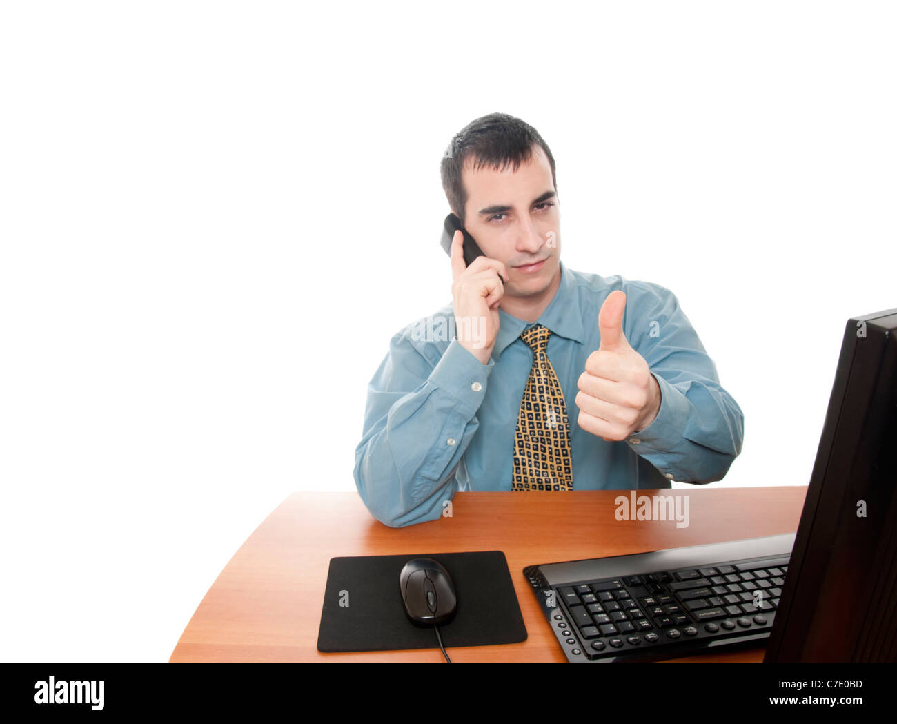 Isolated worker at office desk on white background Stock Photo - Alamy
