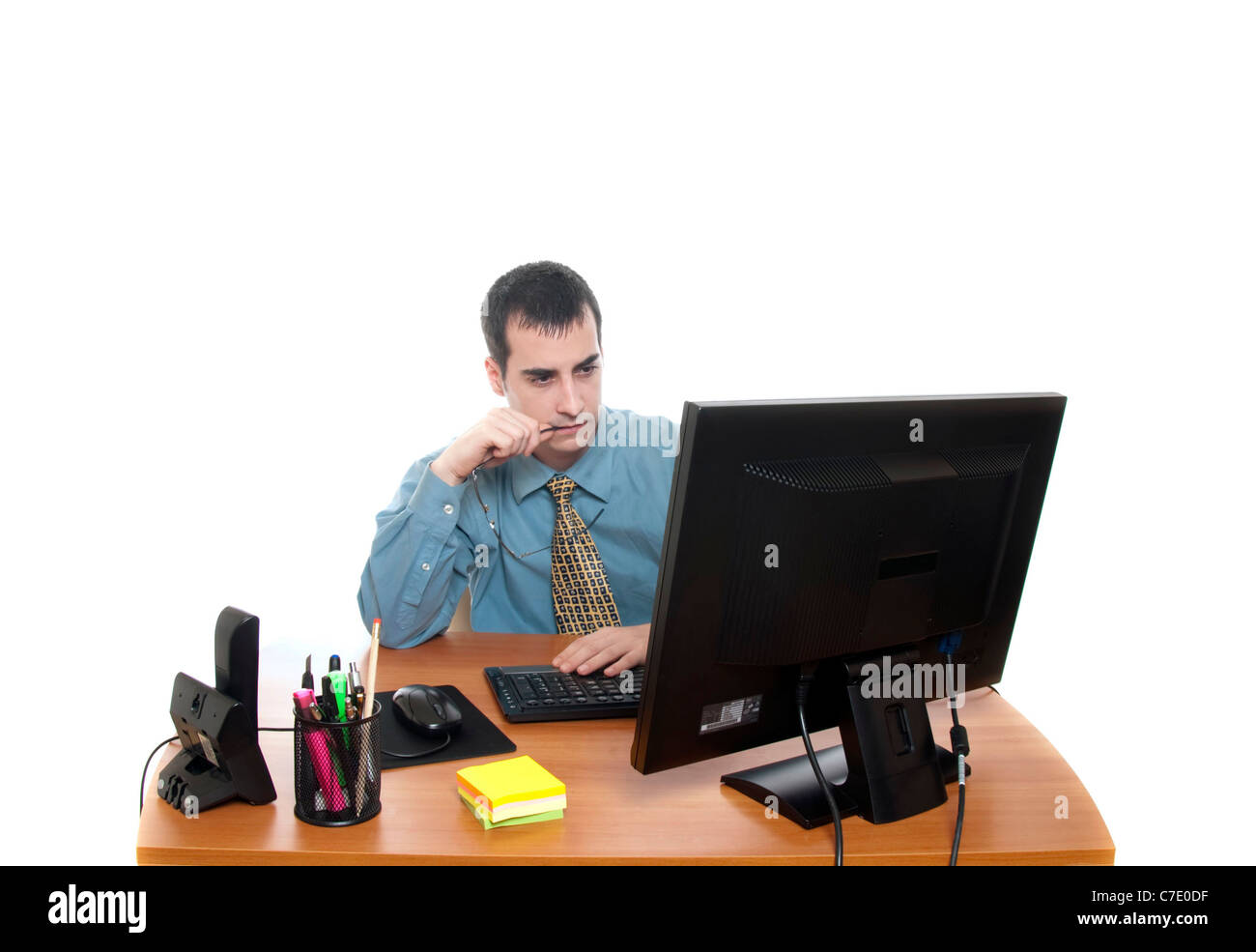 Isolated worker at office desk on white background Stock Photo - Alamy