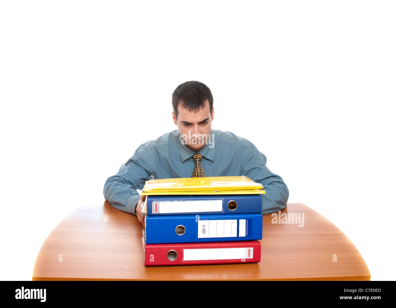 Isolated worker at office desk on white background Stock Photo - Alamy