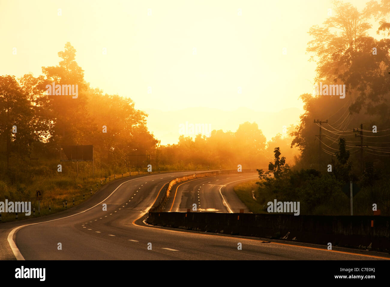 Sharp curve road in sunshine morning Stock Photo - Alamy