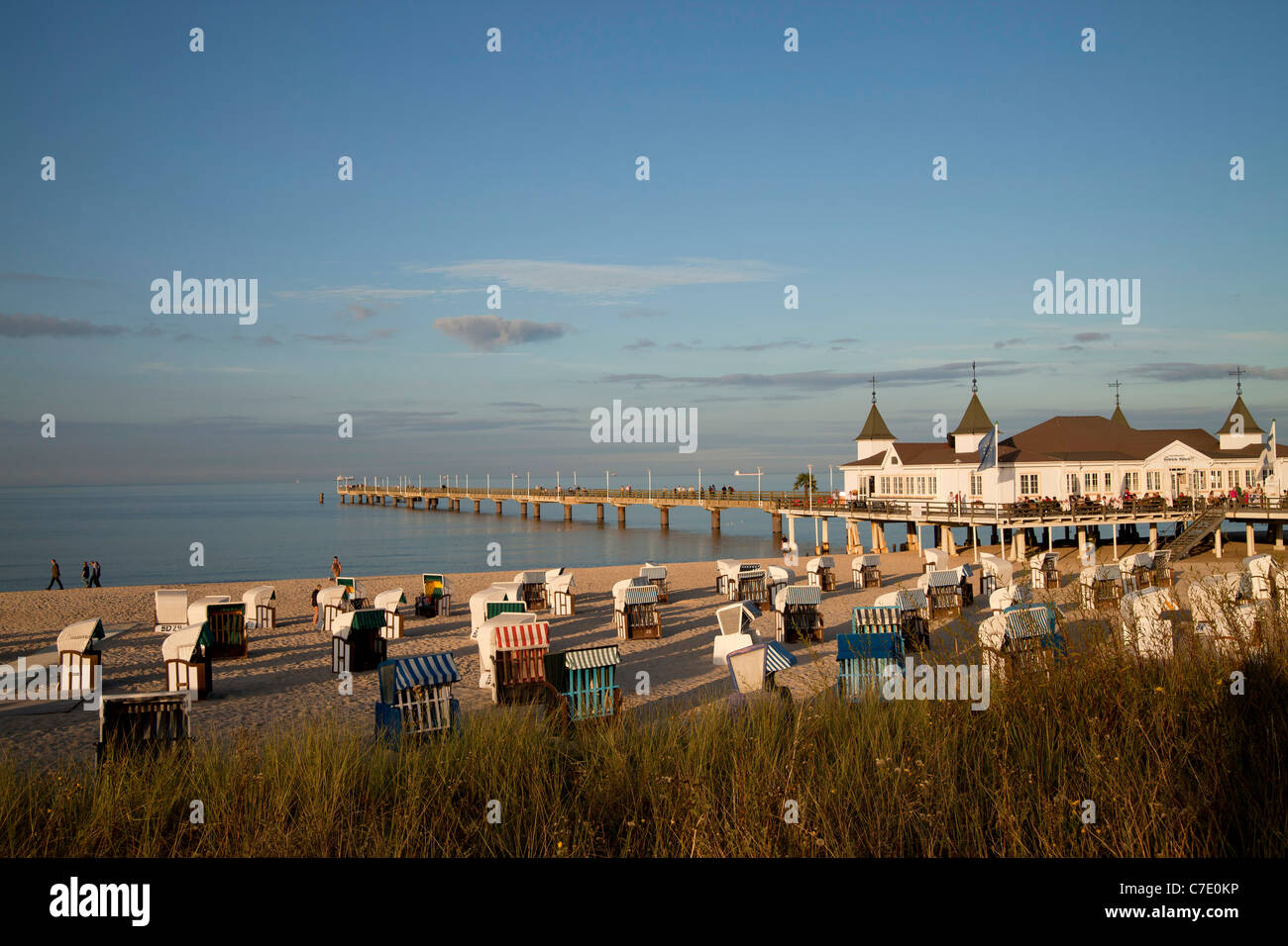 Beach chairs " Strandkorb " and the Seebruecke or Pier at the baltic ...