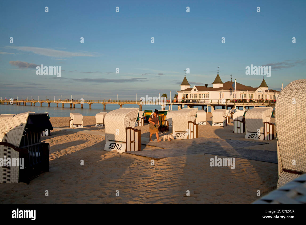 Beach chairs " Strandkorb " and the Seebruecke or Pier at the baltic ...