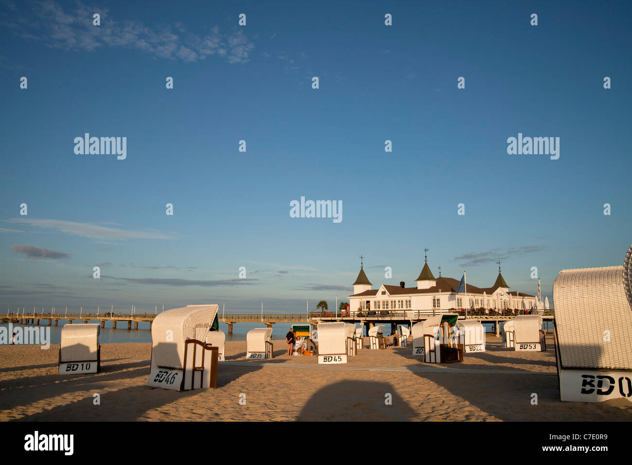 Beach chairs " Strandkorb " and the Seebruecke or Pier at the baltic ...