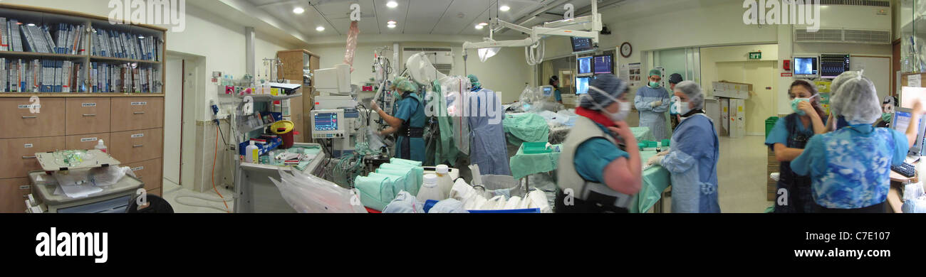 Medical staff during an operation in an operating theatre. Photographed ...