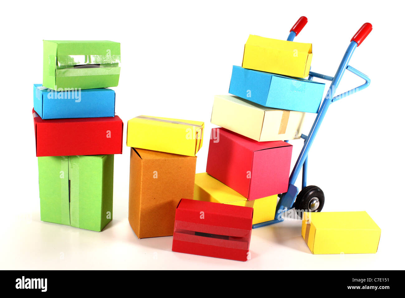 colorful gift boxes on different stacks with sack barrow on a white ...