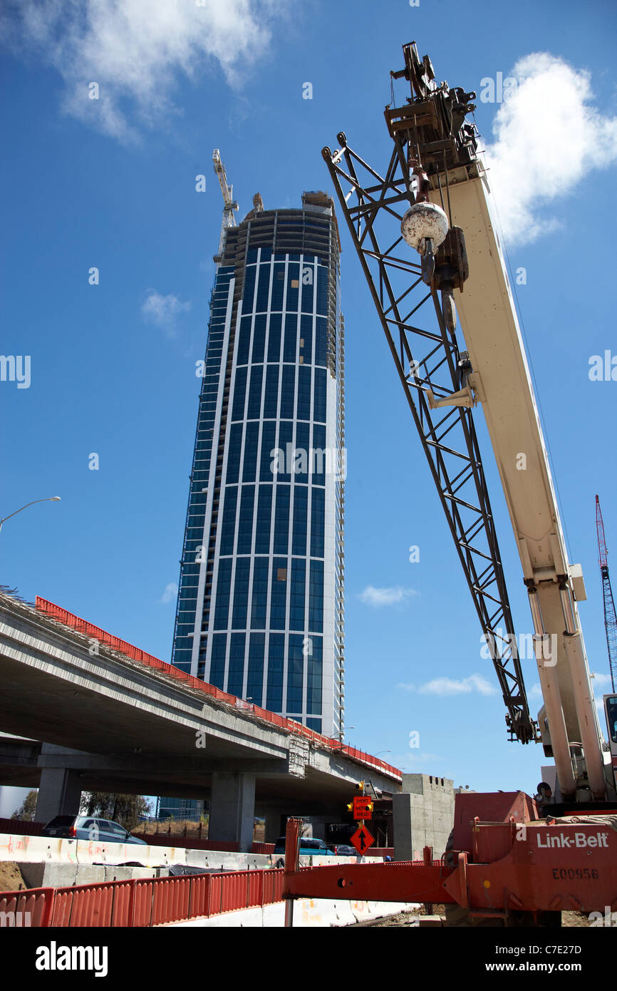 Crane at high-rise building construction site Stock Photo - Alamy