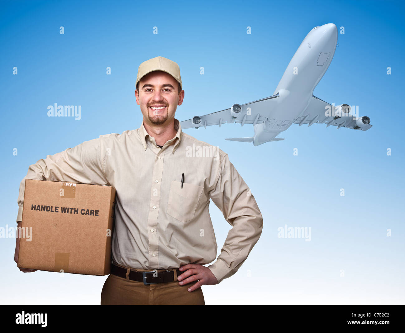 smiling delivery man and cargo airplane Stock Photo - Alamy