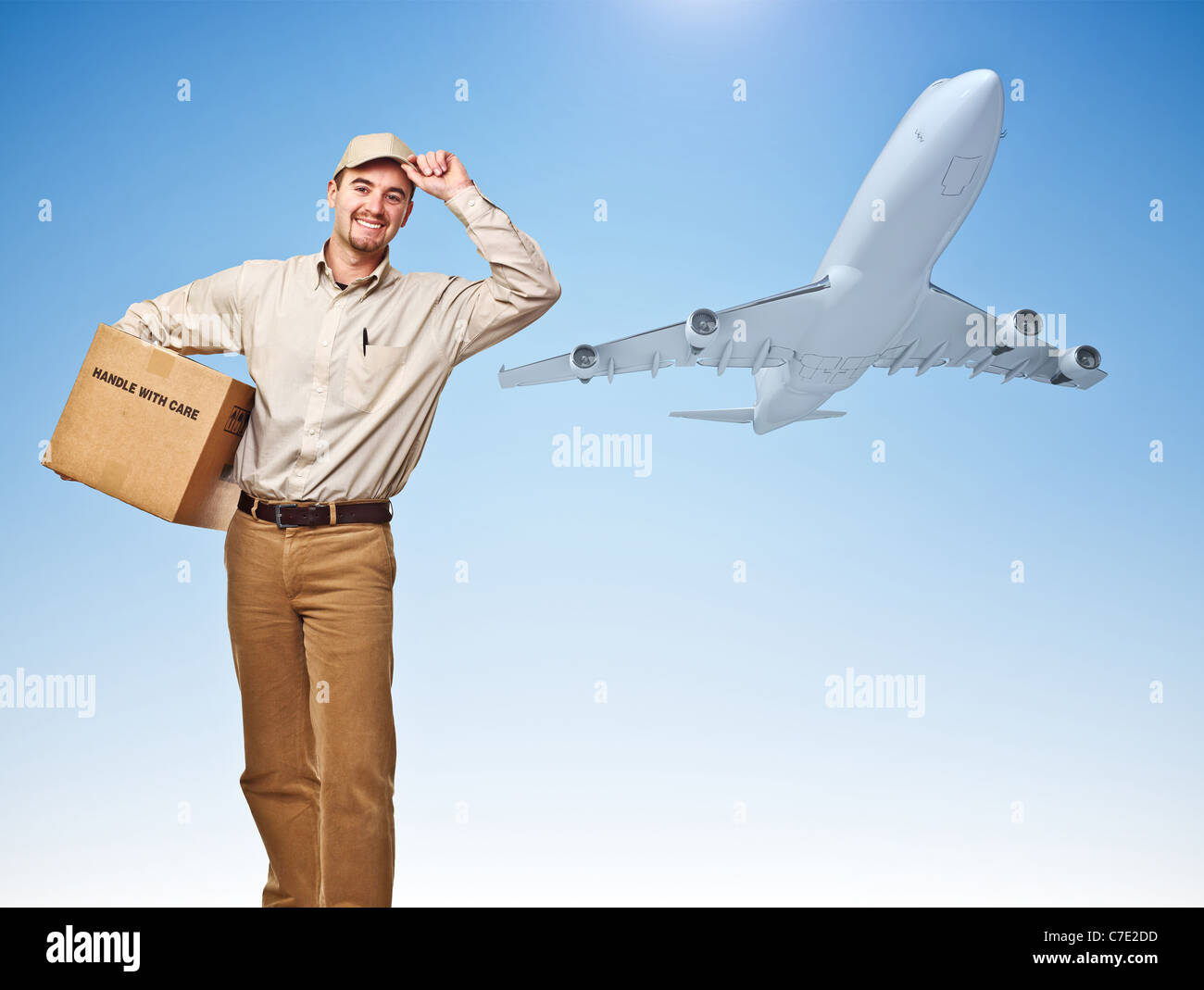 smiling delivery man and cargo airplane Stock Photo - Alamy