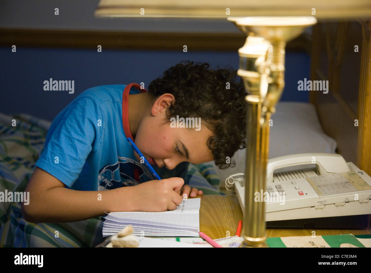 Young tourist boy writing his trip diary in the hotel room, Cairo ...