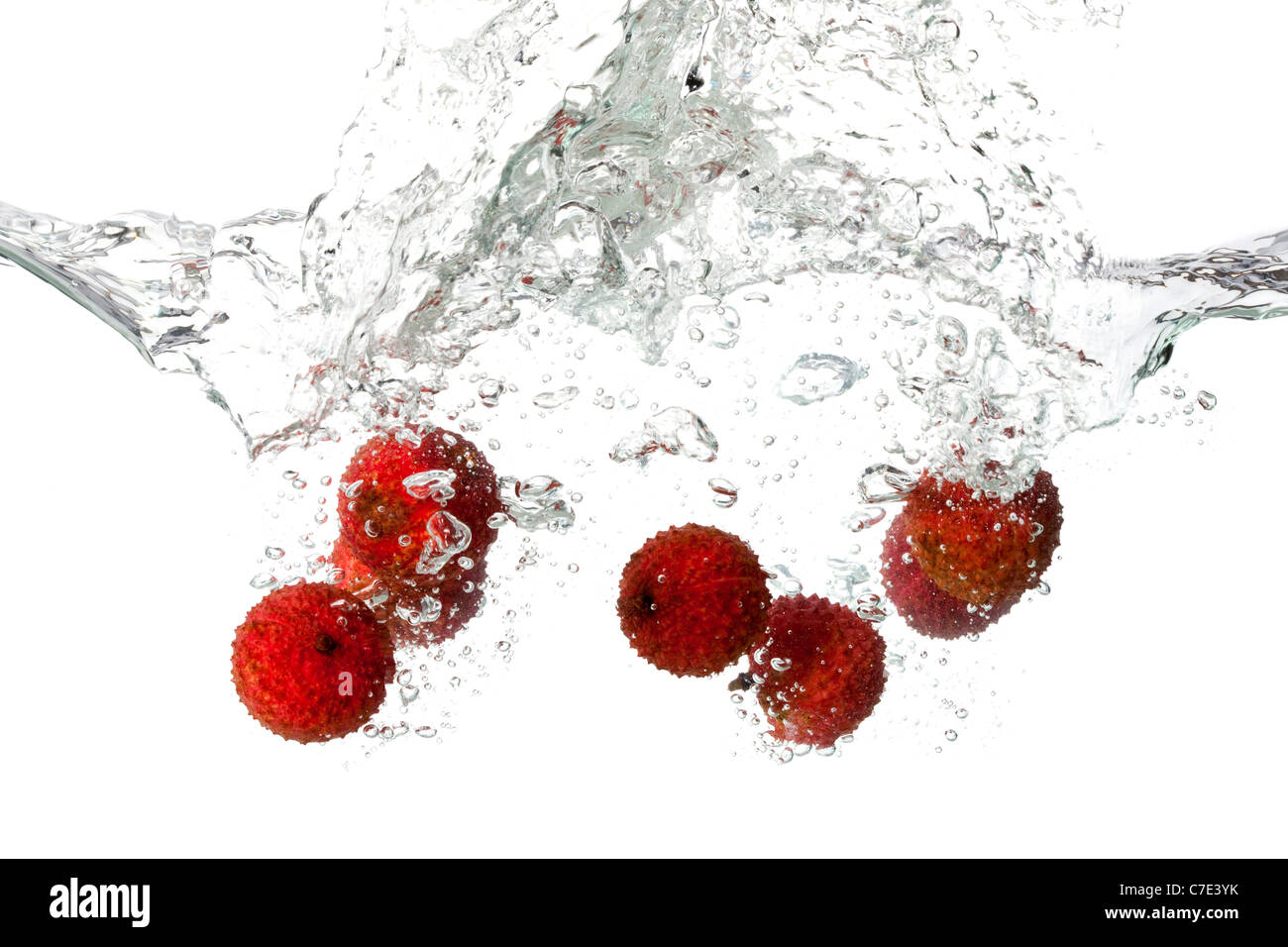 Lychee Splashing into Water Stock Photo - Alamy