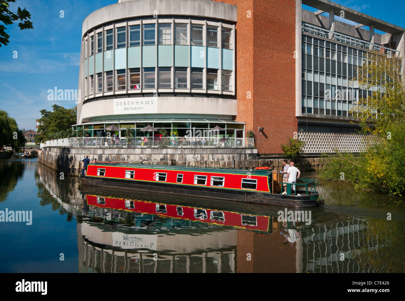 A Narrow Canal Boat Passing The Debenhams Department Store Restaurant ...