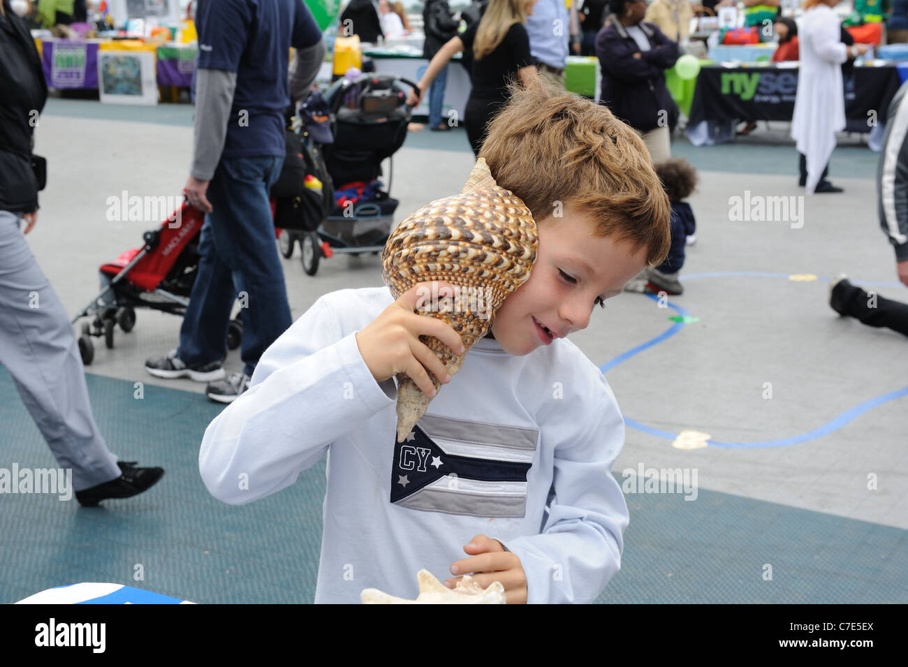 Conch shell ear child hi-res stock photography and images - Alamy