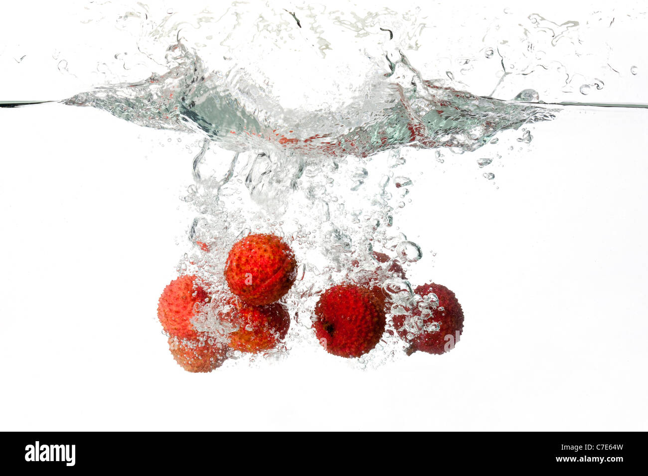 Lychee Splashing into Water Stock Photo - Alamy