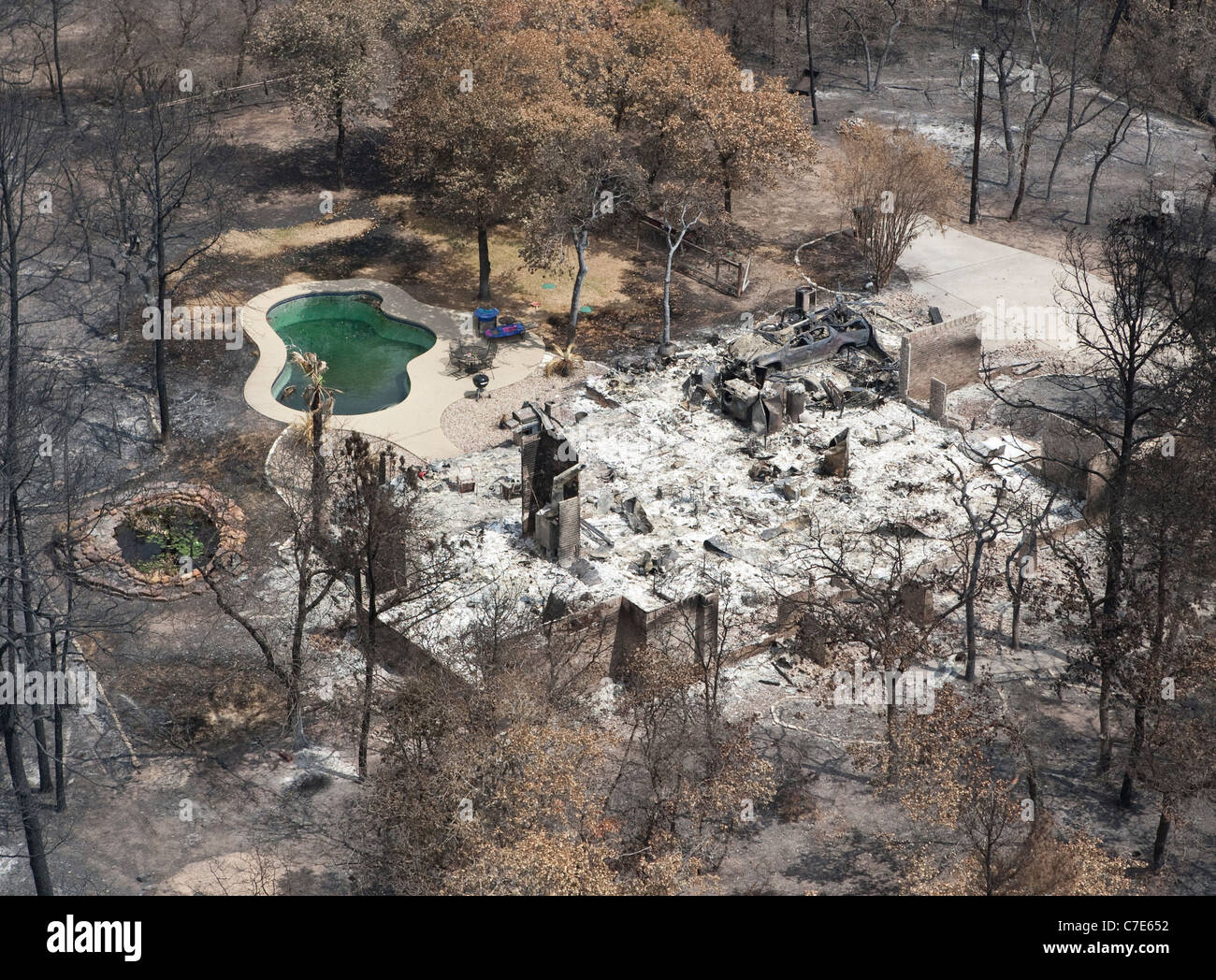 Aerial view of home burned to the ground by wildfires near Bastrop ...